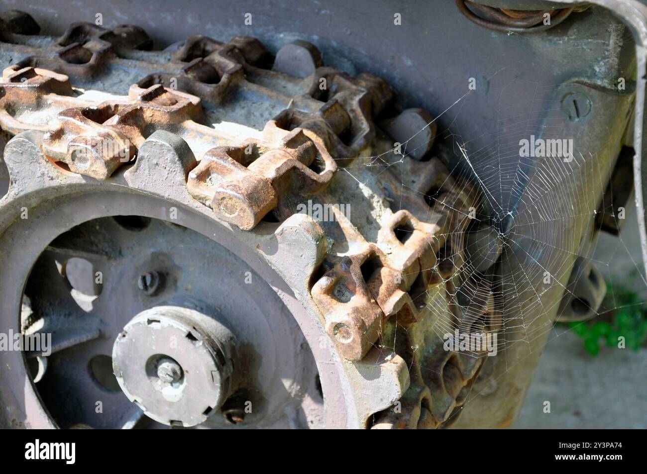 drive wheel and a fragment of a tank caterpillar with cobwebs. End of ...