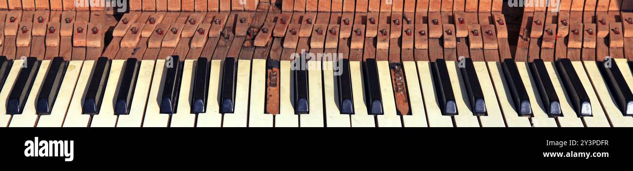 Broken piano and keys. Forgotten piano in a city park. The view of ...