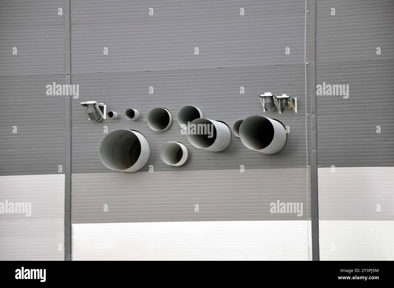 Elements of various ventilation systems in the wall of an industrial ...