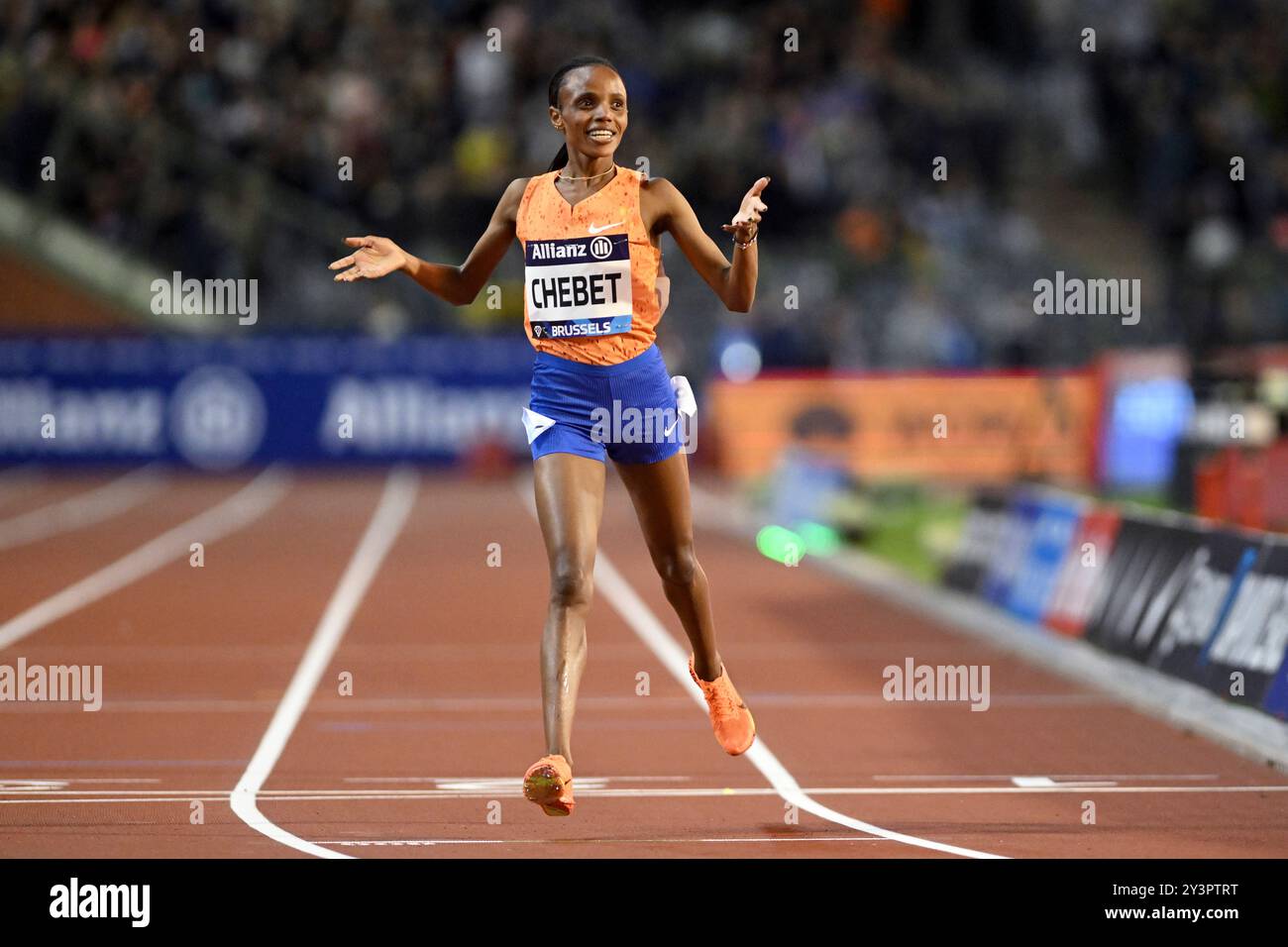 Beatrice Chebet, of Kenya, crosses the finish line to win the women's ...