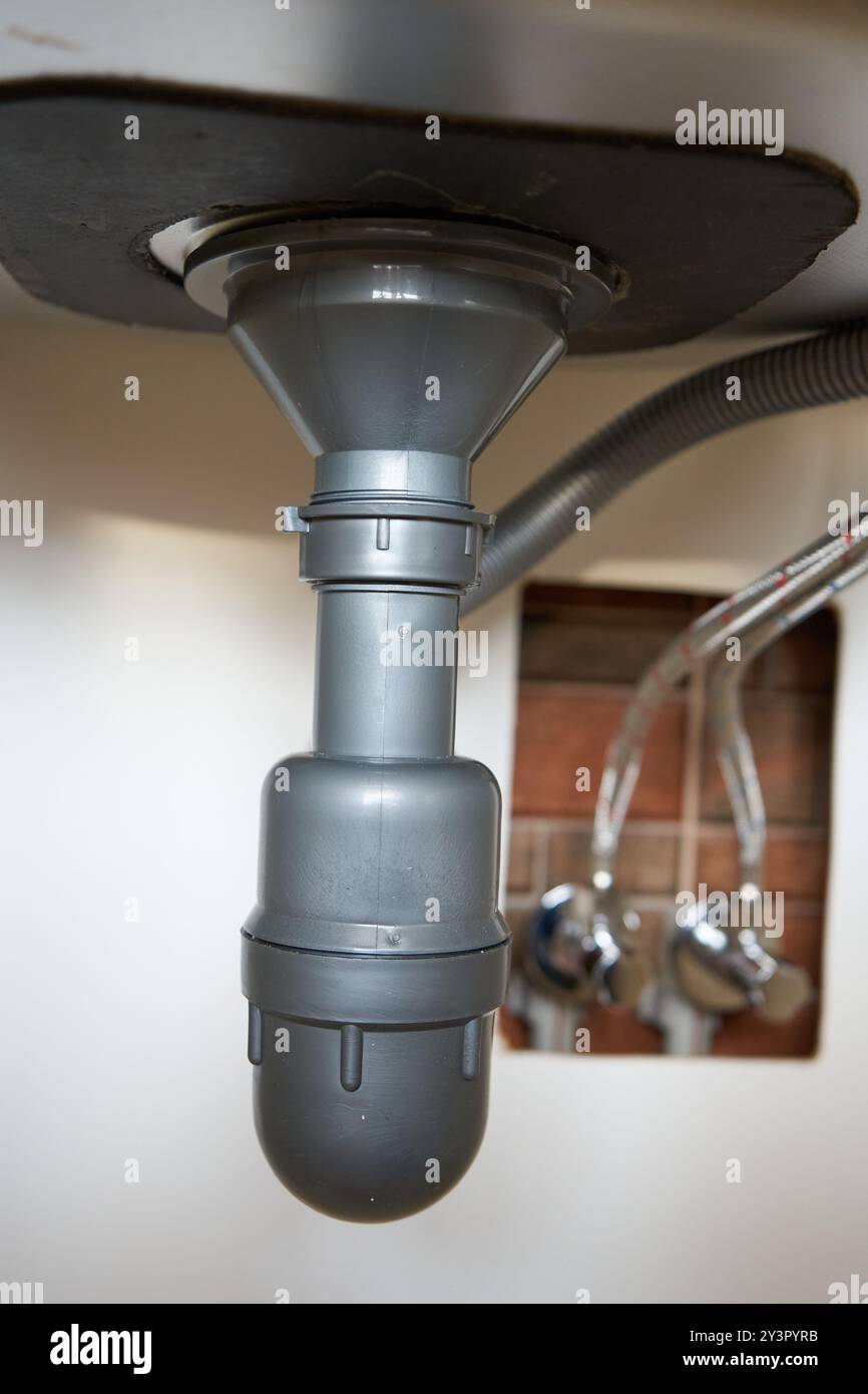 gray siphon pipe for water drains, connection of the siphon pipe under ...