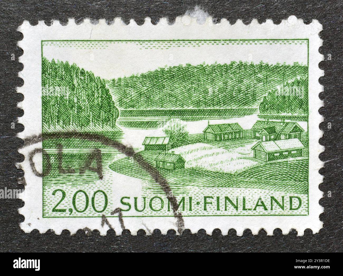 Cancelled postage stamp printed by Finland, that shows Farm on Lake ...