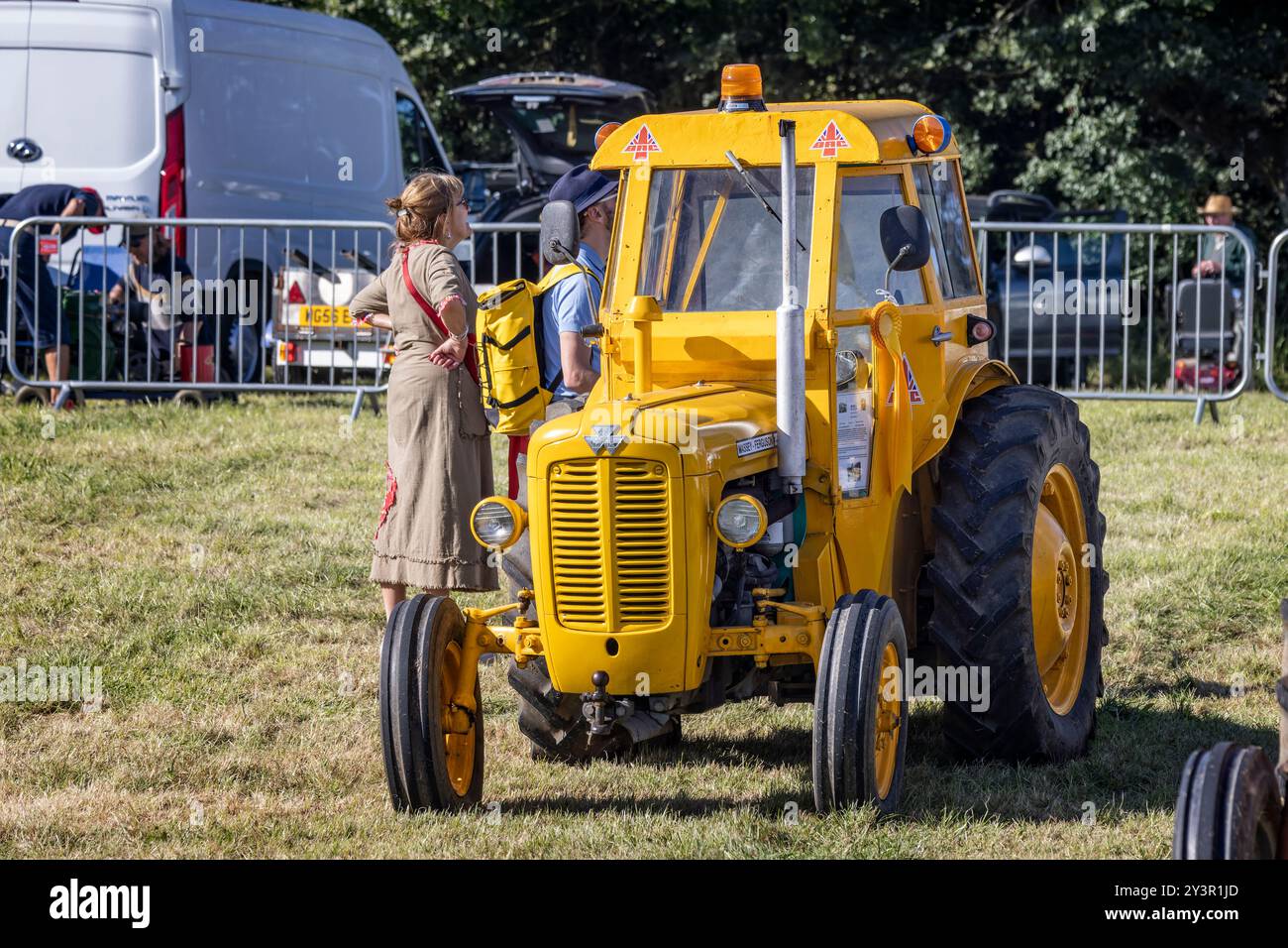Close up of a bright yellow vintage Massey Ferguson tractor on display ...