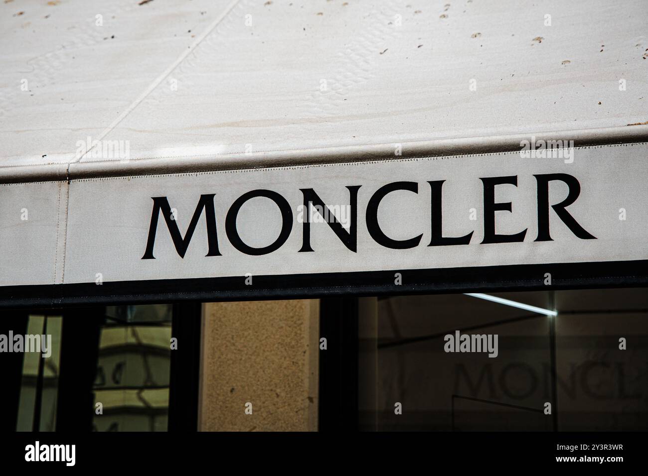 Venice, Italia, 17 of August 2024: A prominently displayed sign reveals a chic outerwear ...