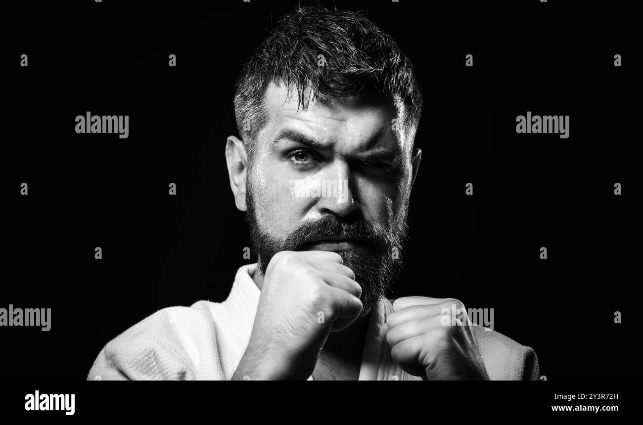 Karate man preparing for competition. Strong muscular fighter ready for ...