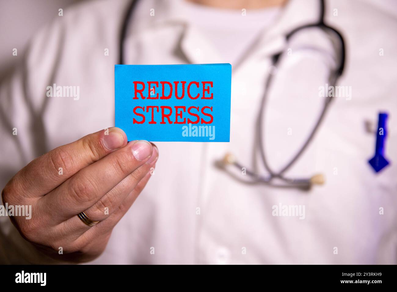 Reduce Stress card in hands of Medical Doctor Stock Photo - Alamy