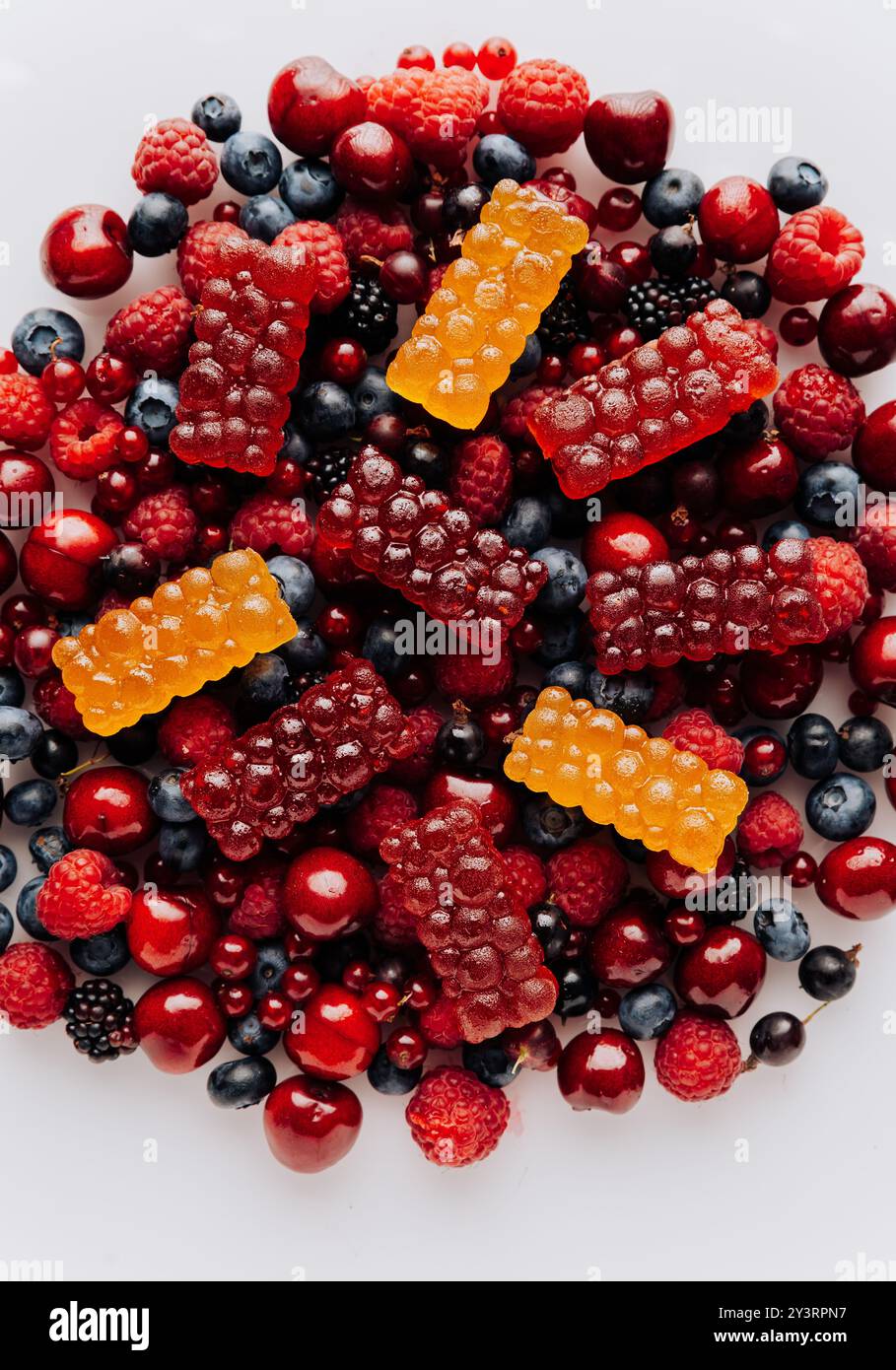 Colorful natural berry marmalade on fresh mixed fruits and berries ...