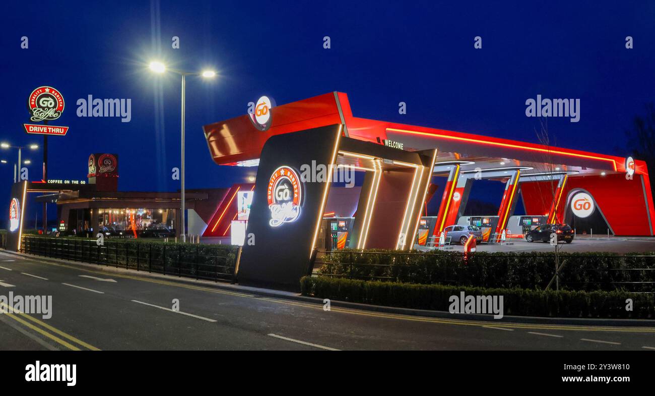 Petrol station at night.UK Modern petrol station and coffee shop. Go ...