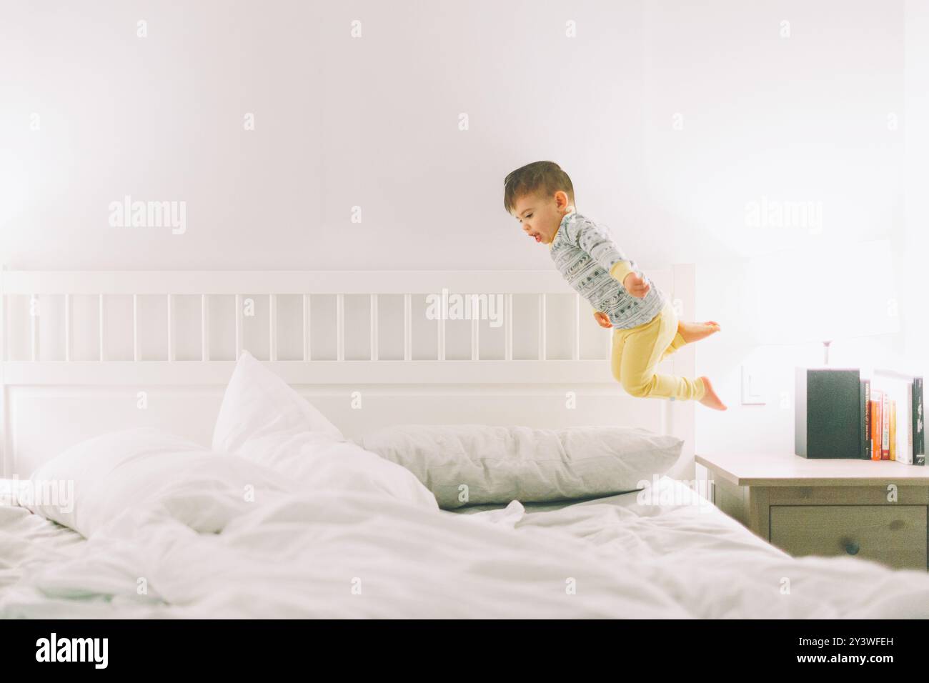 Toddler jumping bed hi-res stock photography and images - Alamy