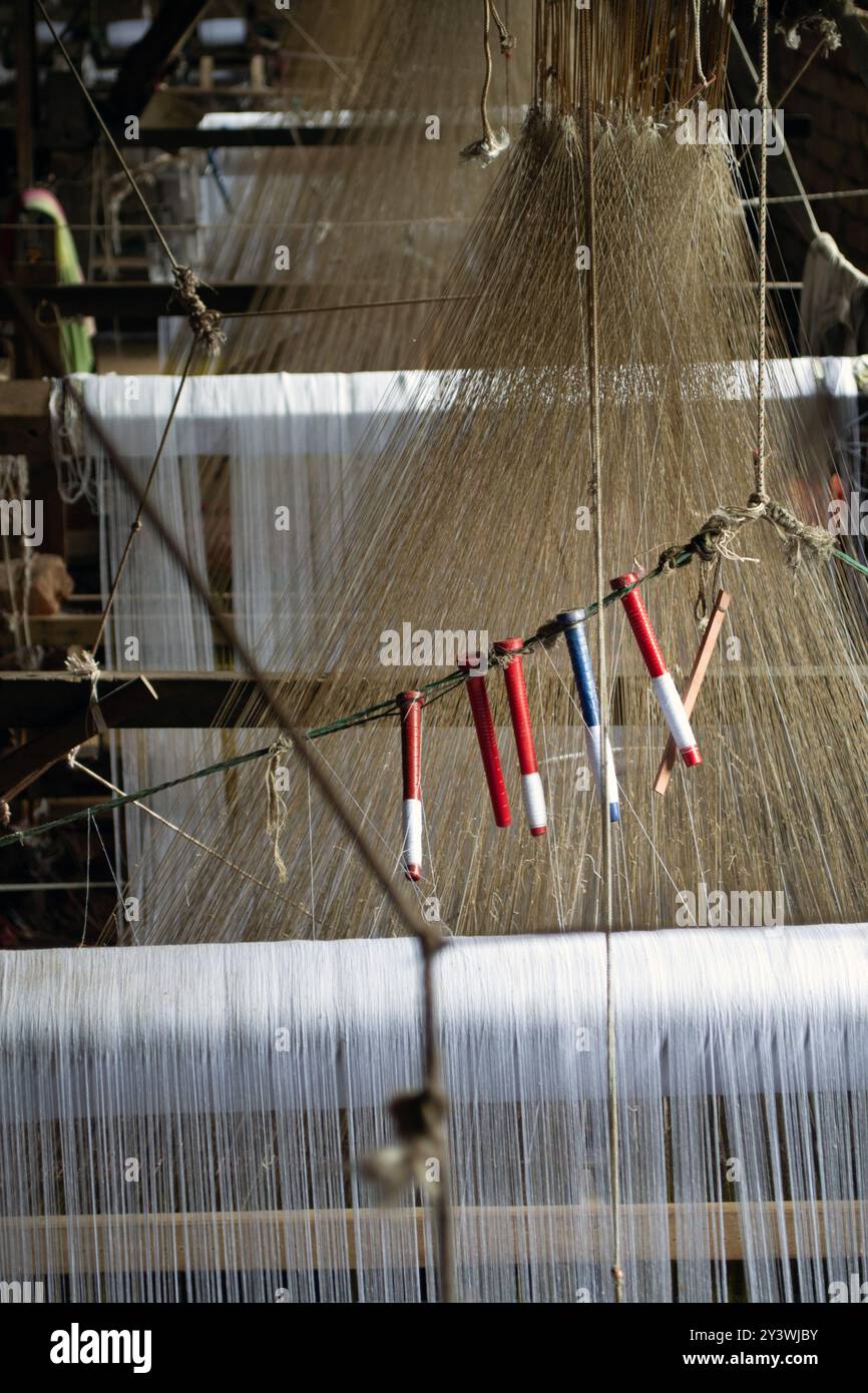 Tansen, Nepal.Equipment for processing traditional textiles lays idle ...