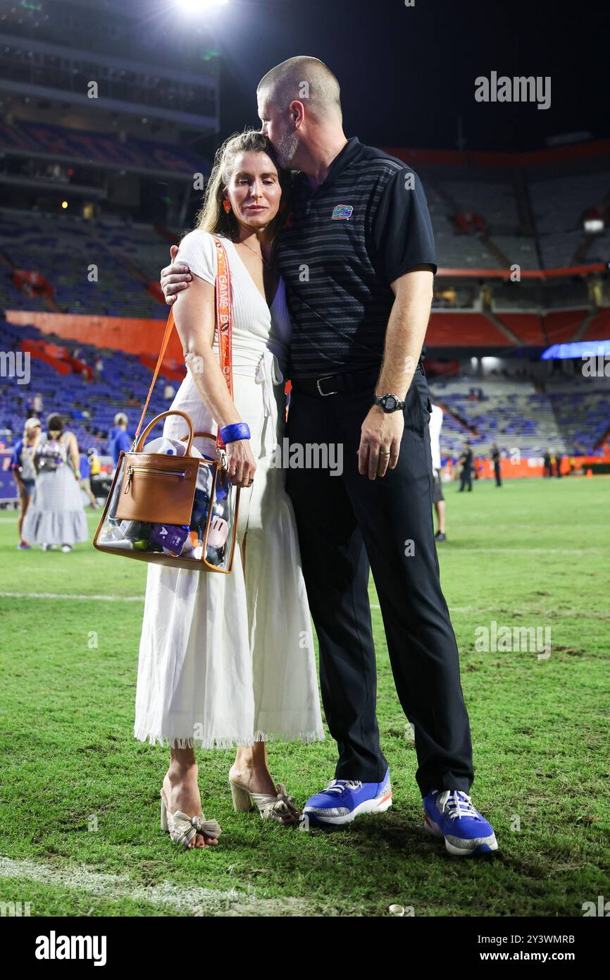 Florida head coach Billy Napier kisses his wife Ali Napier after an ...