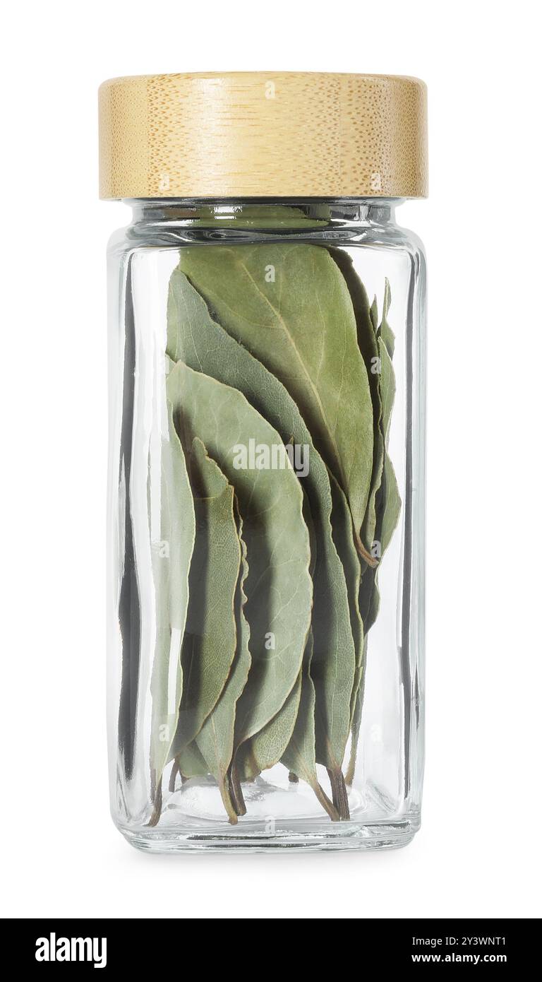 Dry bay leaves in glass jar isolated on white Stock Photo - Alamy