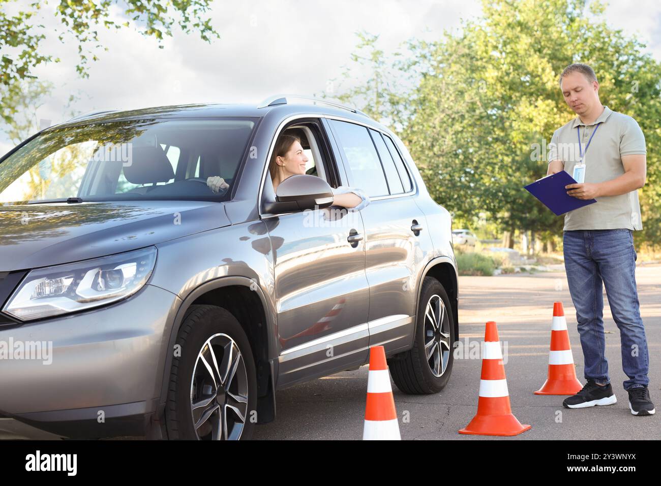 Woman passing maneuverability driving test on track Stock Photo - Alamy
