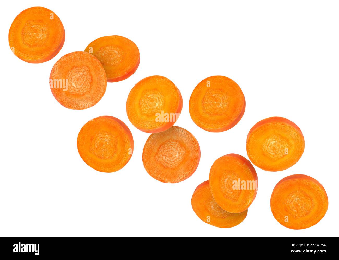 Round carrot slices in air on white background Stock Photo - Alamy