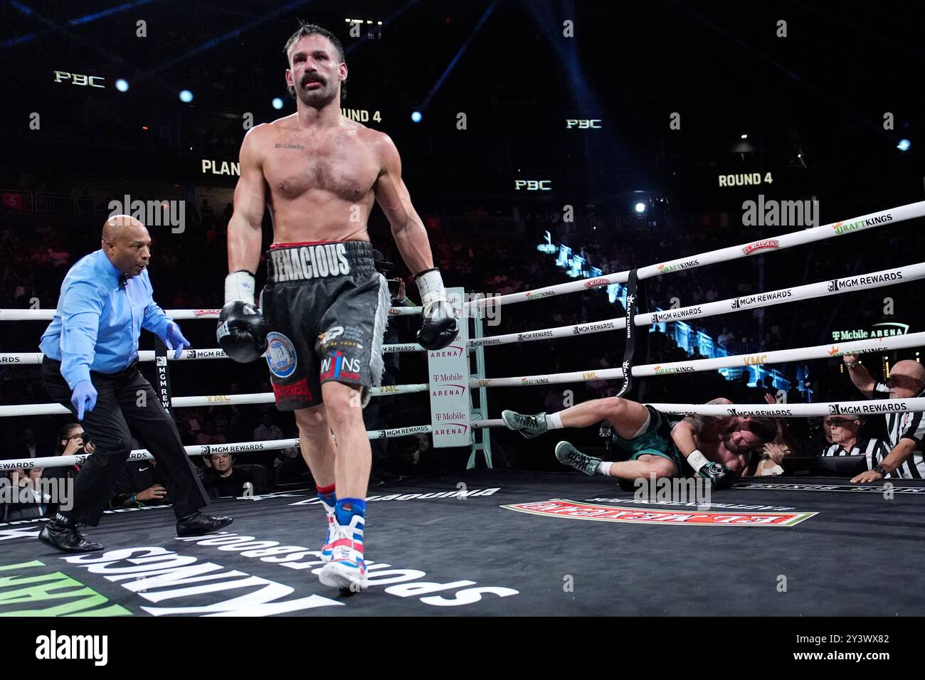 Trevor McCumby knocks down Caleb Plant in an interim super middleweight ...