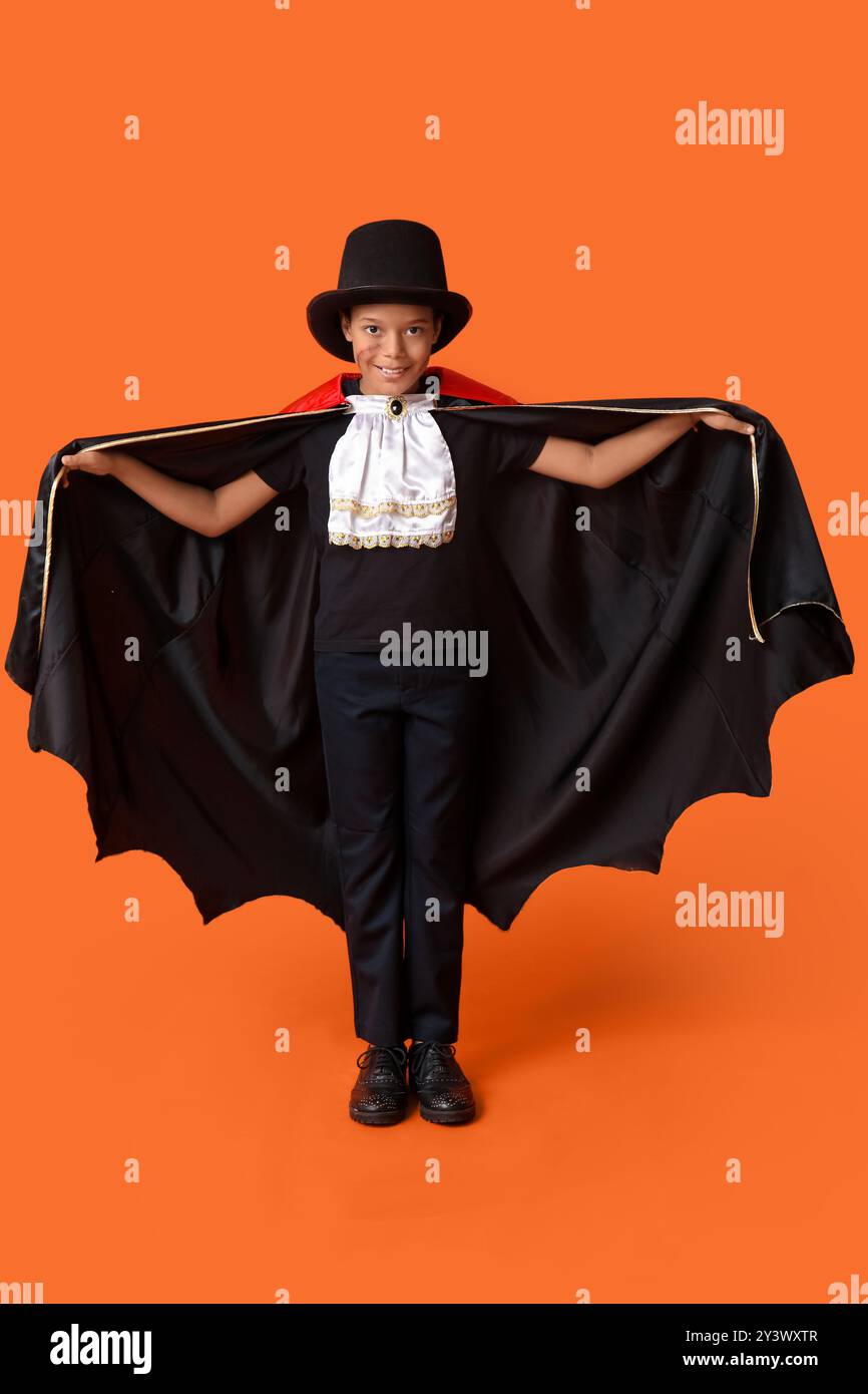 Cute happy African-American boy dressed as Dracula for Halloween party ...