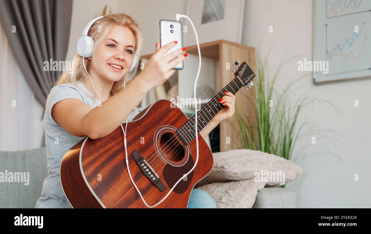 Online conference. Happy woman. Guitar playing. Excited lady in ...