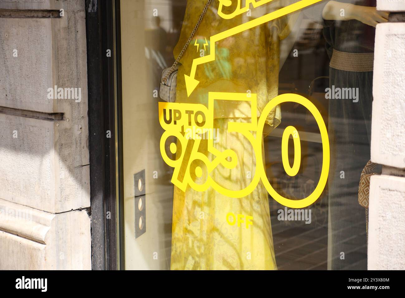Inside the retail store, a prominent Discount Sale Display features ...