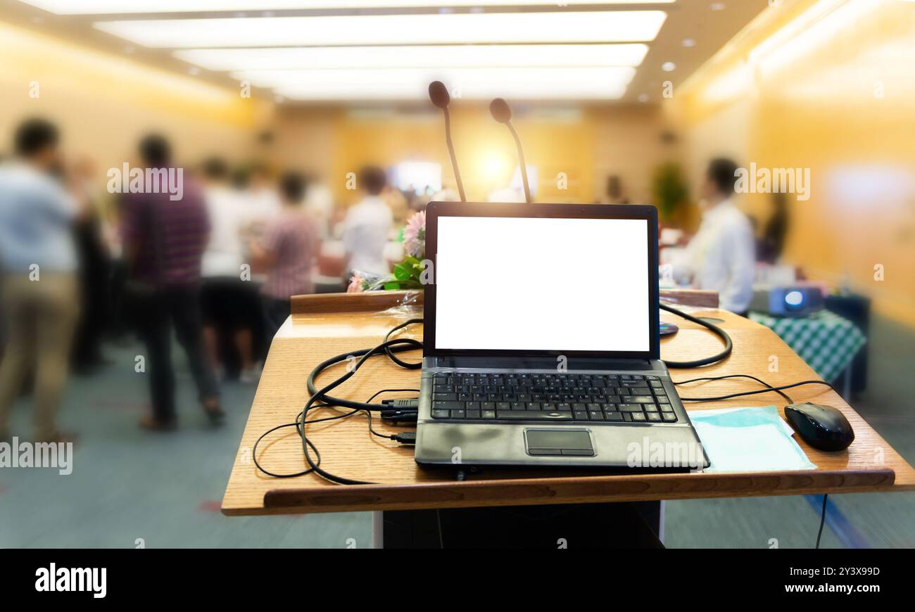 Speaker's table with laptop in conference room Stock Photo - Alamy