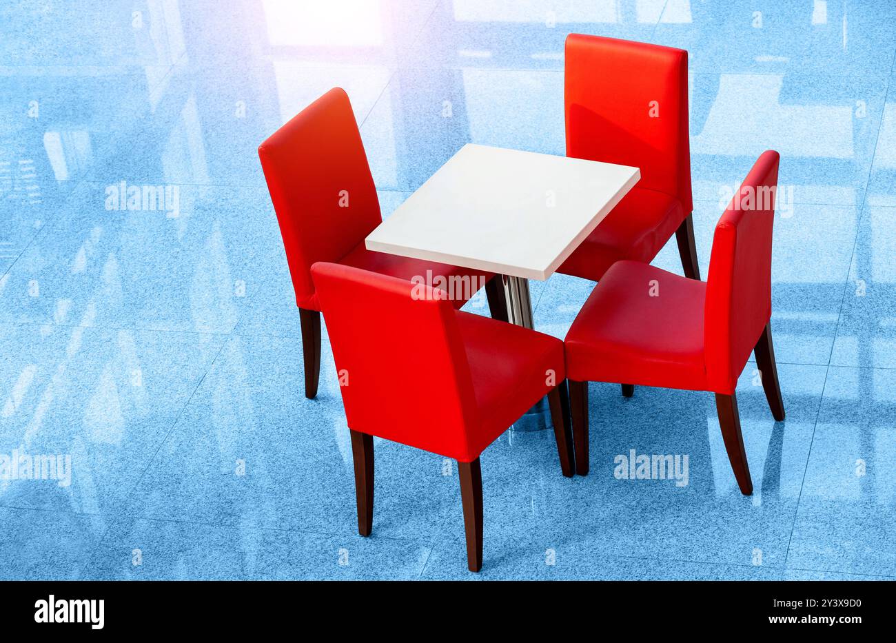 Above view of white table with four red chairs Stock Photo - Alamy