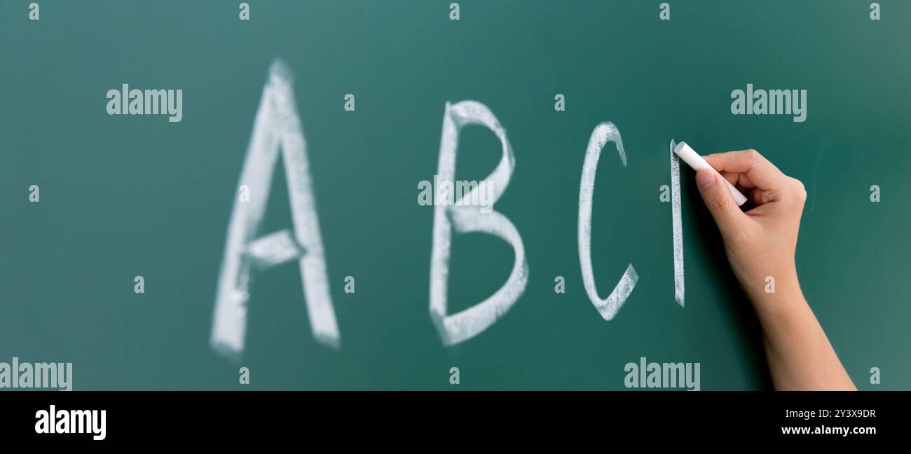 Hand writing alphabet abcd on chalkboard Stock Photo - Alamy