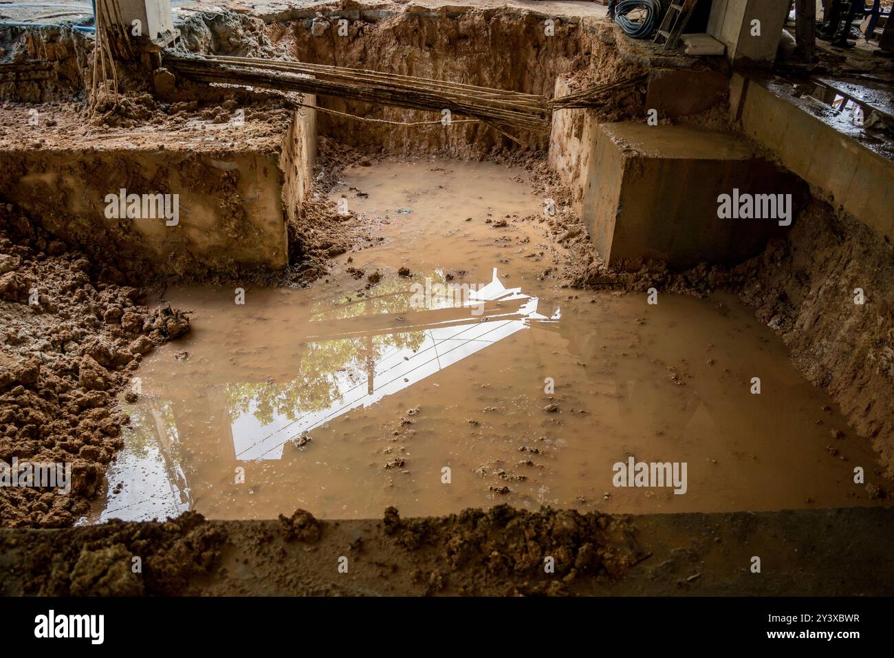 Large pile of earth in which there are many metal reinforcement bars ...