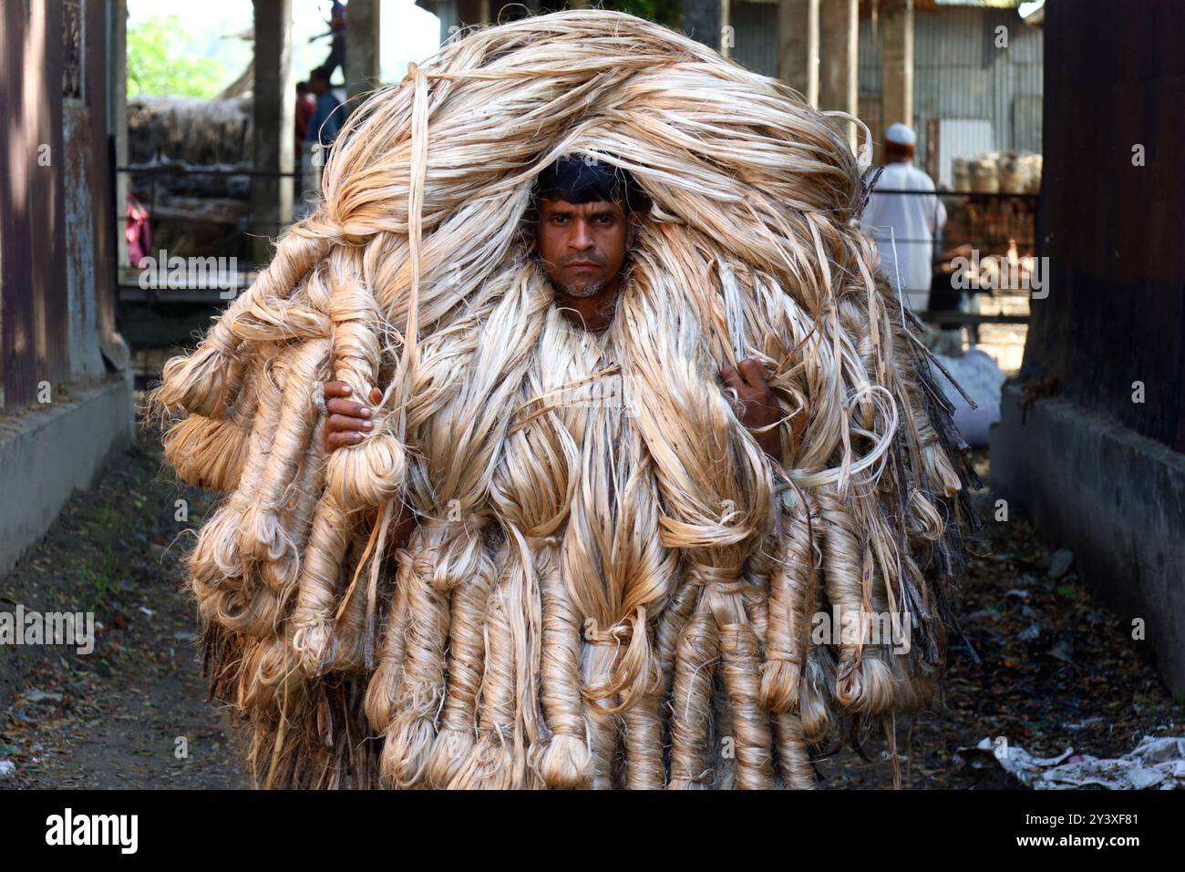 September 15, 2024, Manikganj, Manikganj, Bangladesh: Worker carries ...
