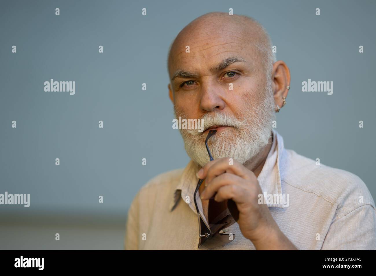 Middle-aged senior grandfather close up portrait. Grey hair white beard ...