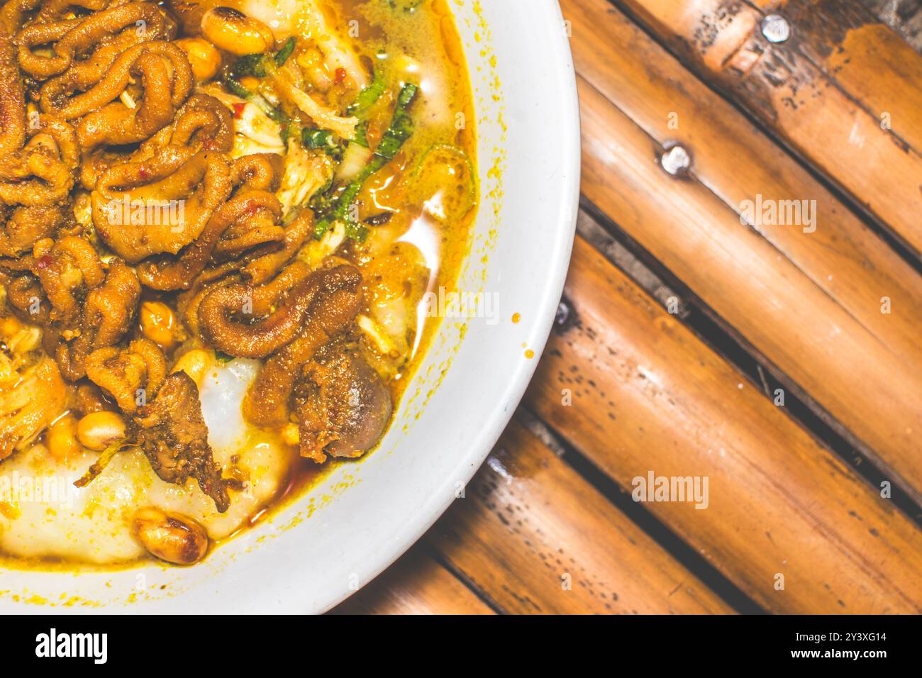 Chicken porridge bowl served with unique dishes. Traditional chicken ...