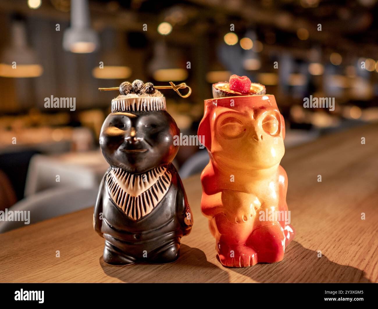 Authentic Tiki Drink Cocktails. Two tropical tiki cocktails on bar ...