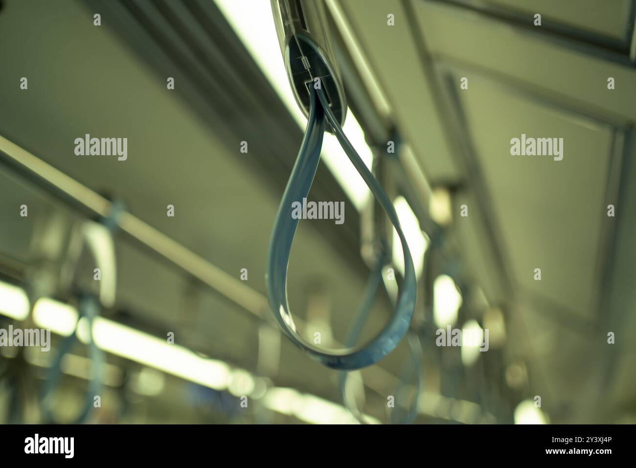 A handle in a train for standing passenger Stock Photo - Alamy