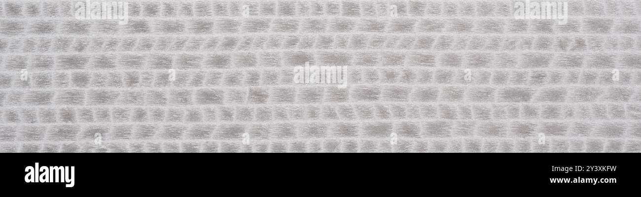 The soft, woven texture of bleached oak veneer displays a grid of pale ...