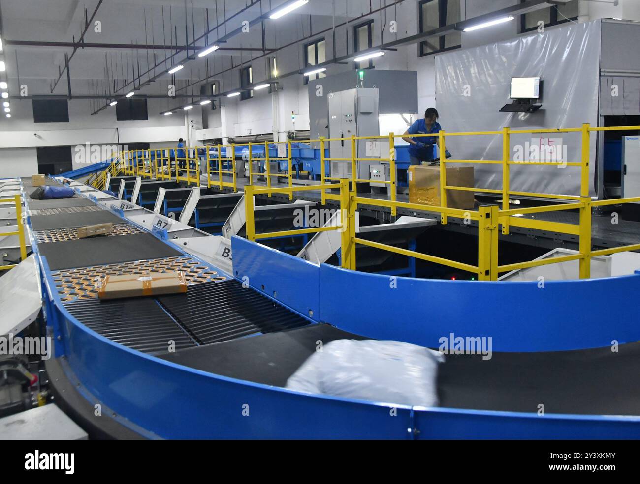 HANDAN, CHINA - SEPTEMBER 15, 2024 - Staff members sort Express ...