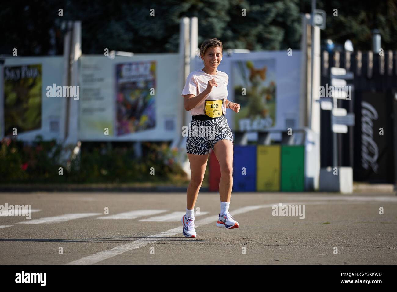 Cheerful Ukrainian woman running a charity marathon "Run For Freedom ...