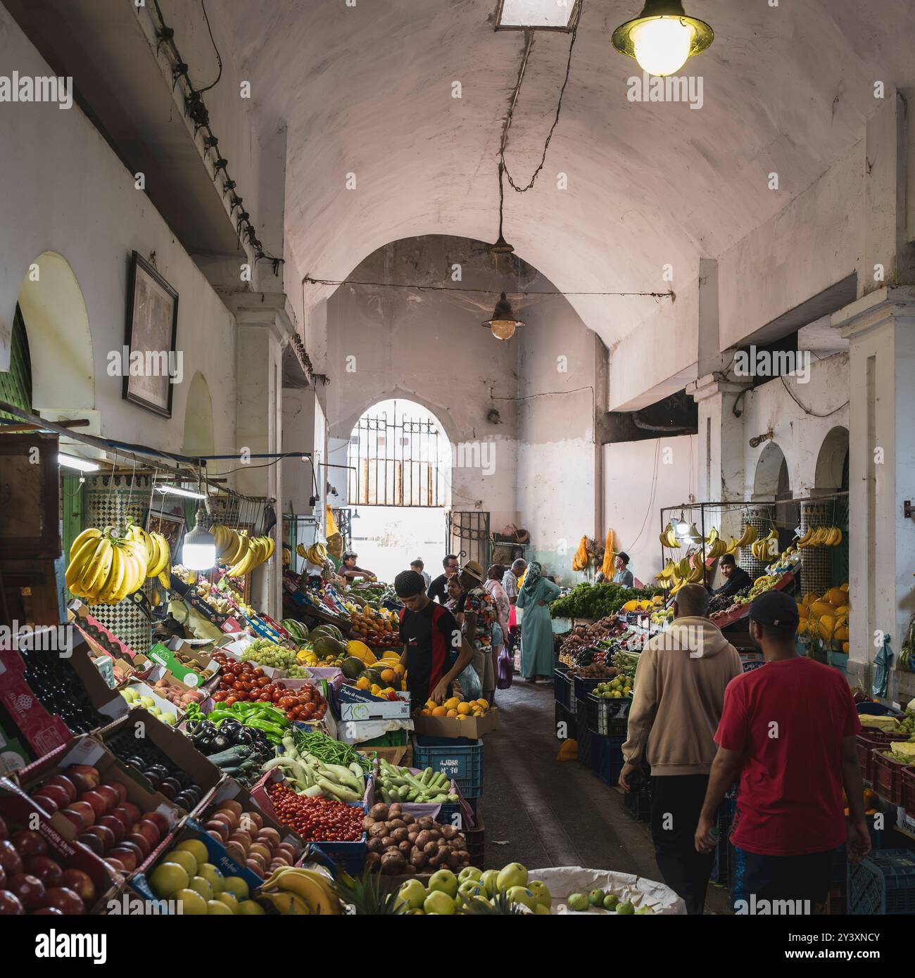 The Asilah or Assilah central market. Fruit stands inside a traditional ...