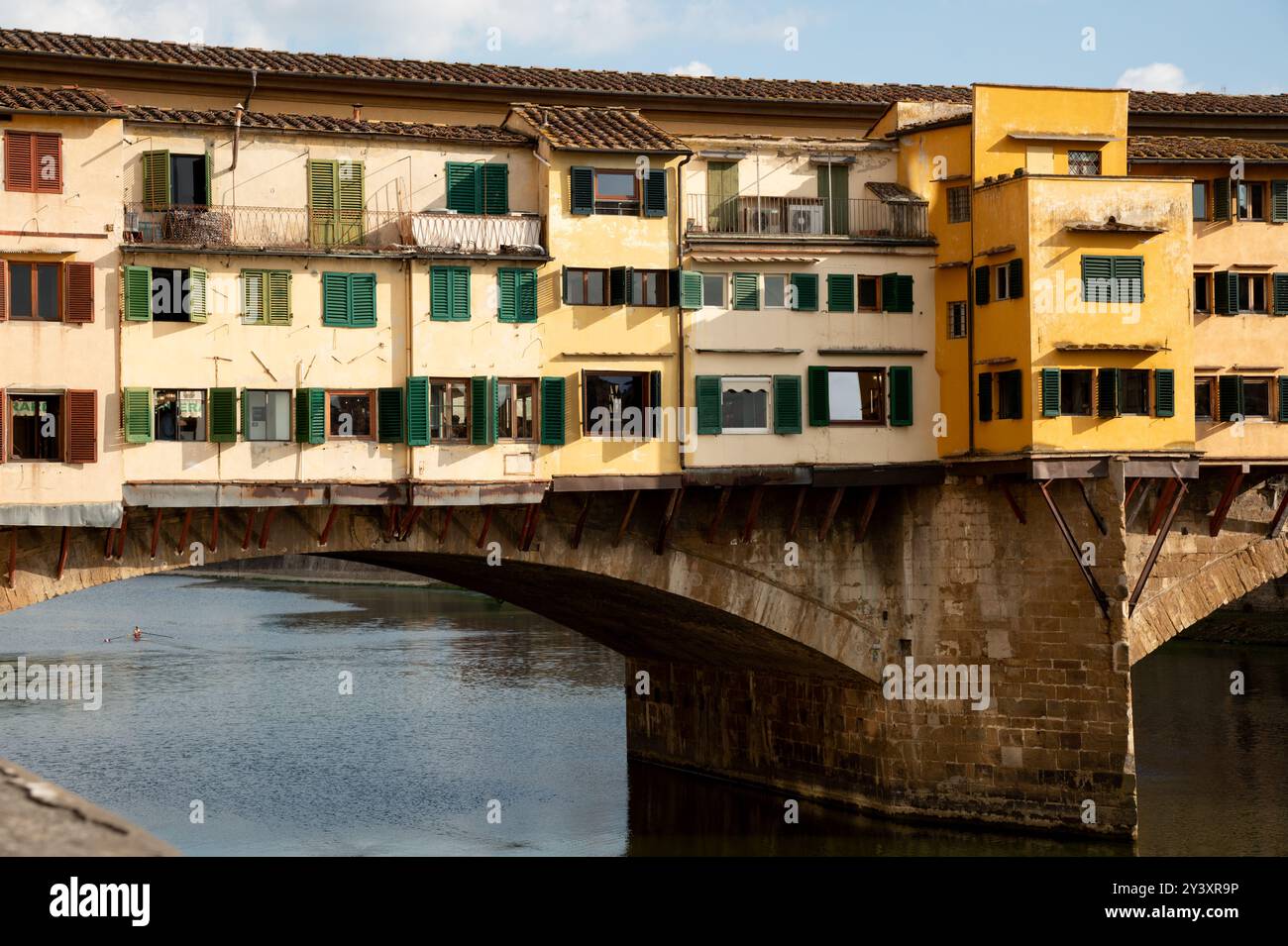 Ponte vecchio bridge showing apartments and shops over the arno river ...