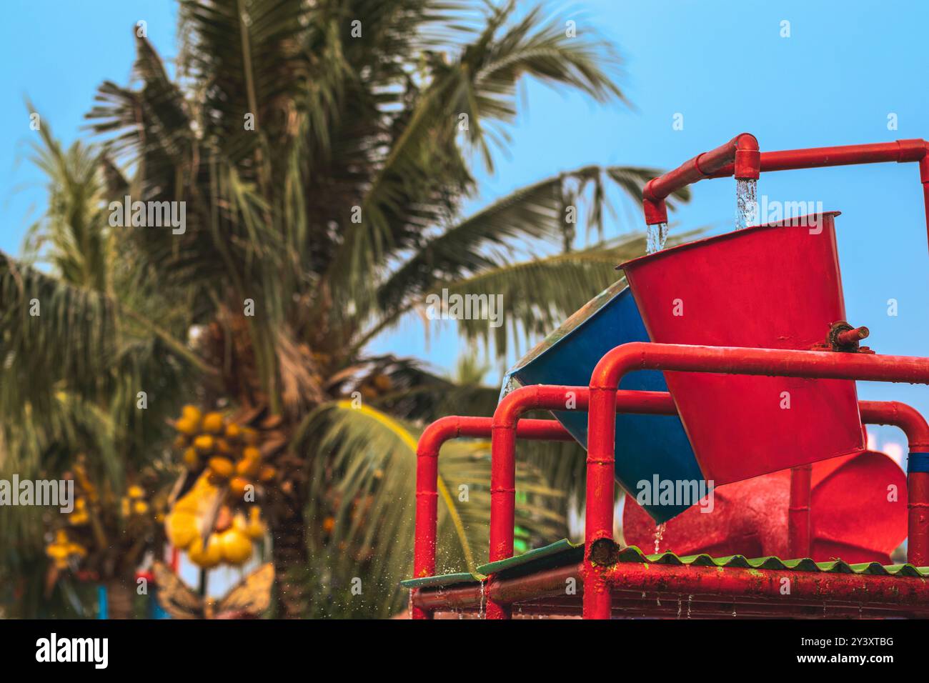 Water spill on water bucket attraction in water park. Water splash on ...