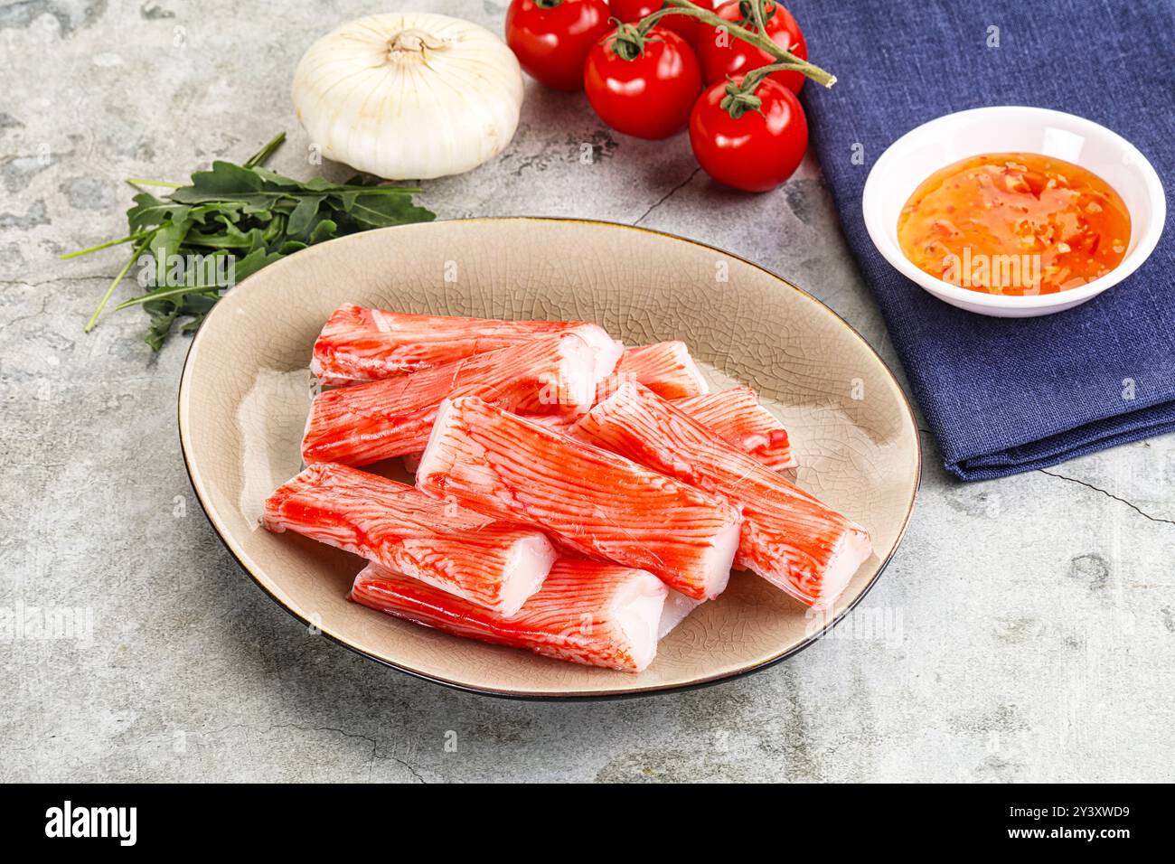 Tasty Crab stics surimi heap with sauce Stock Photo - Alamy