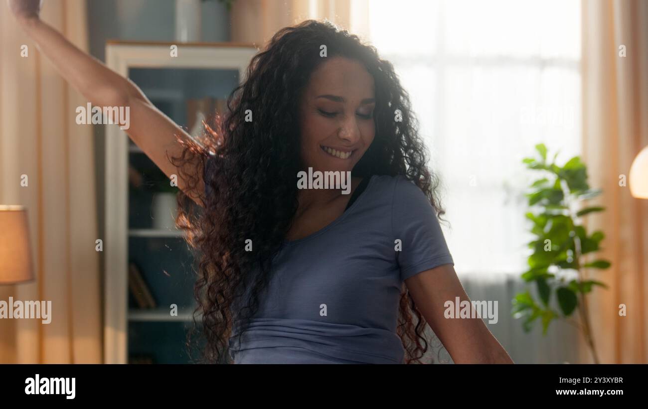Happy joyful sporty Hispanic young girl woman female in big jeans ...