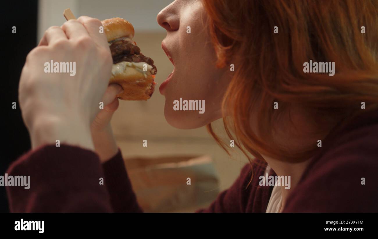 Close up hungry Caucasian woman female customer client buyer eating ...