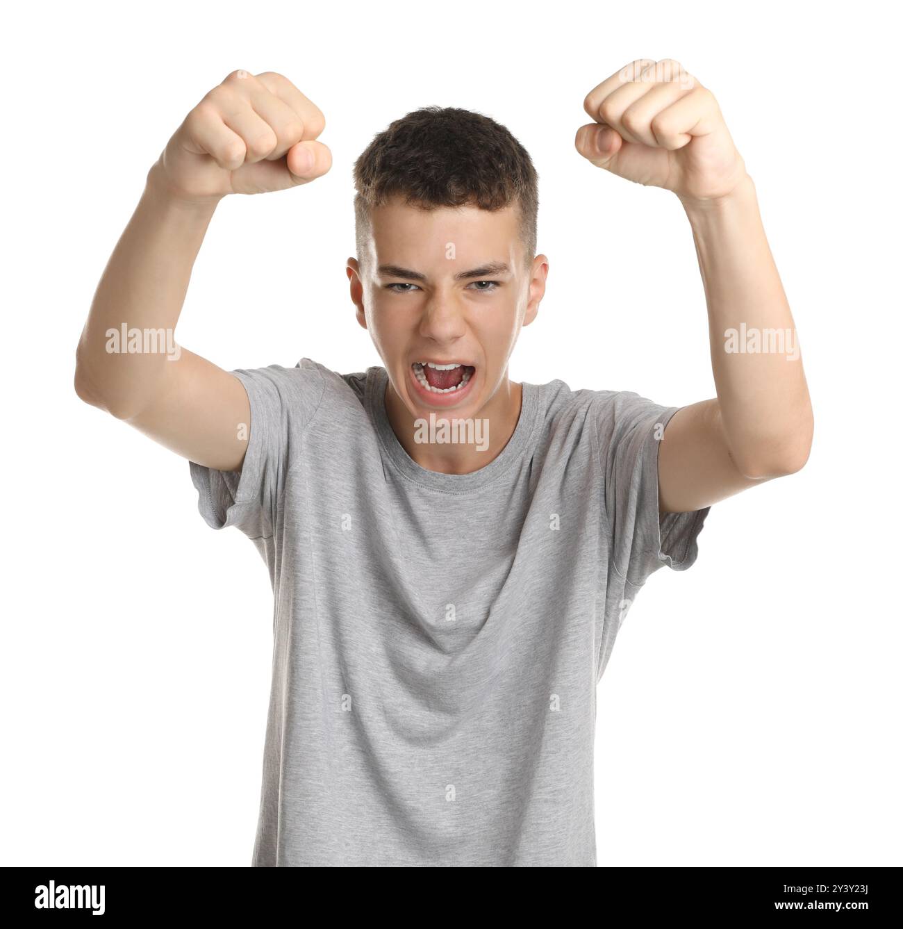 Portrait of angry teenage boy on white background Stock Photo - Alamy