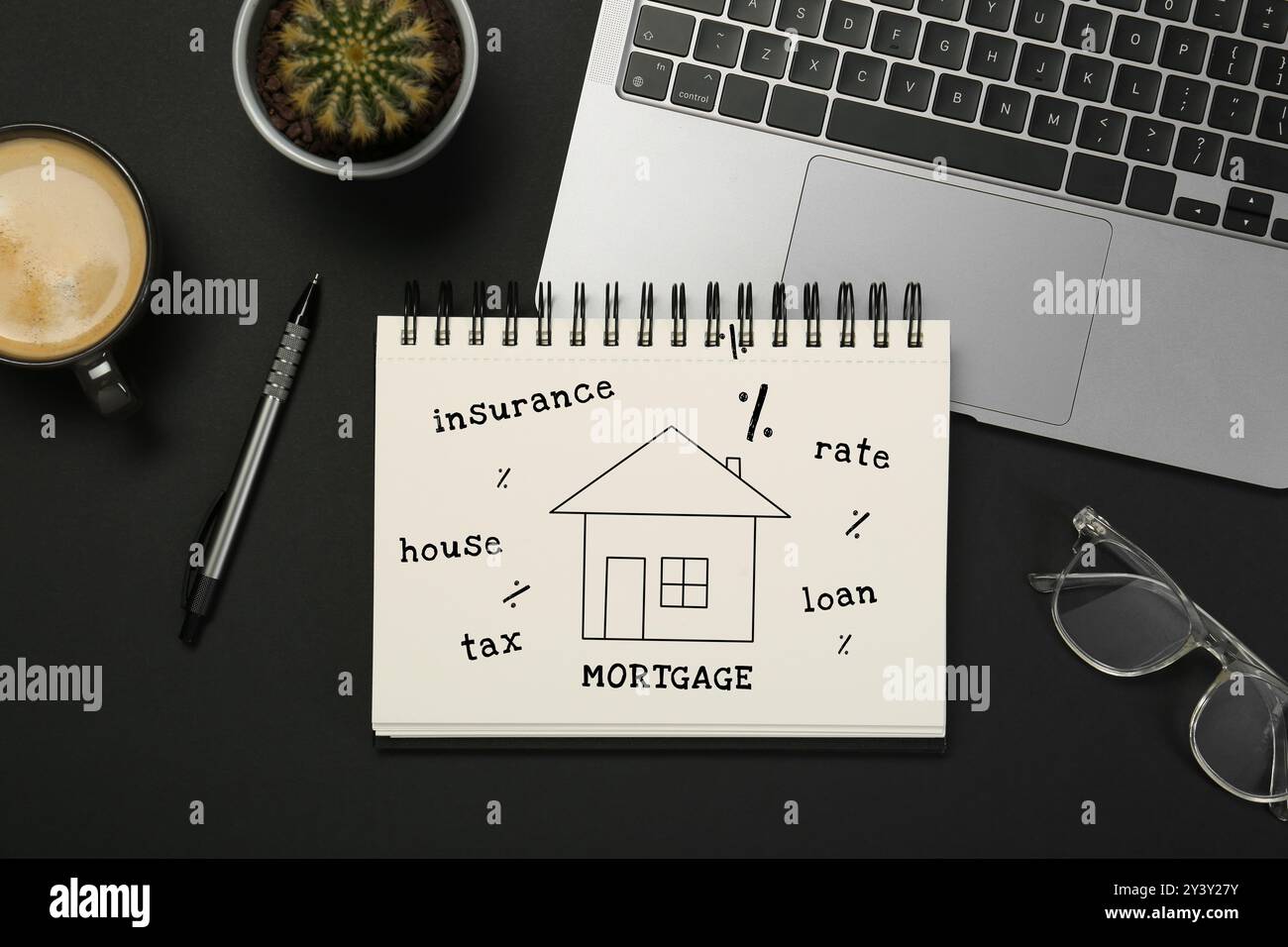 Mortgage. Notebook with drawing of house, percent signs and words on ...