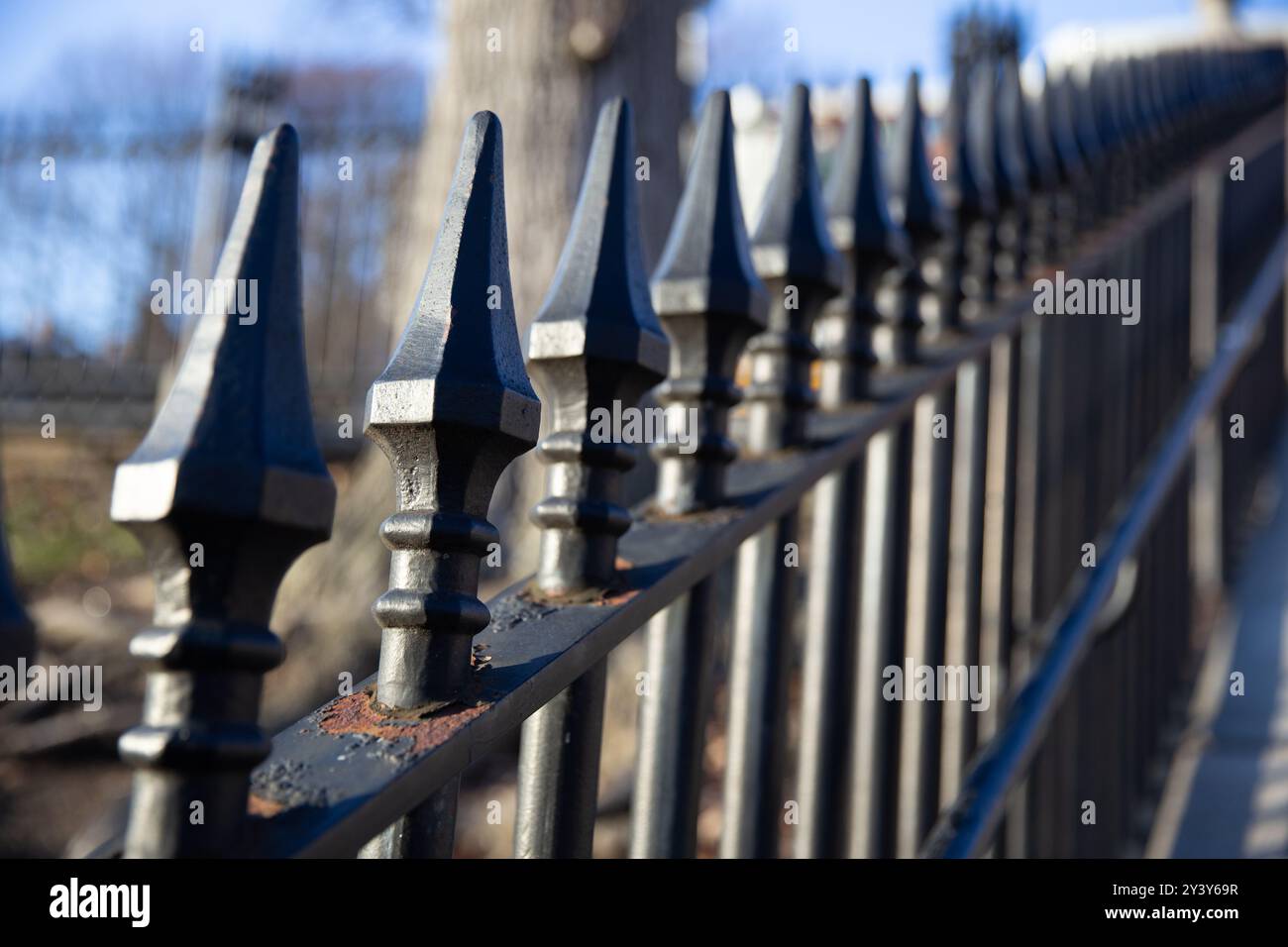 Black Spiked Fence along a walk way Stock Photo - Alamy