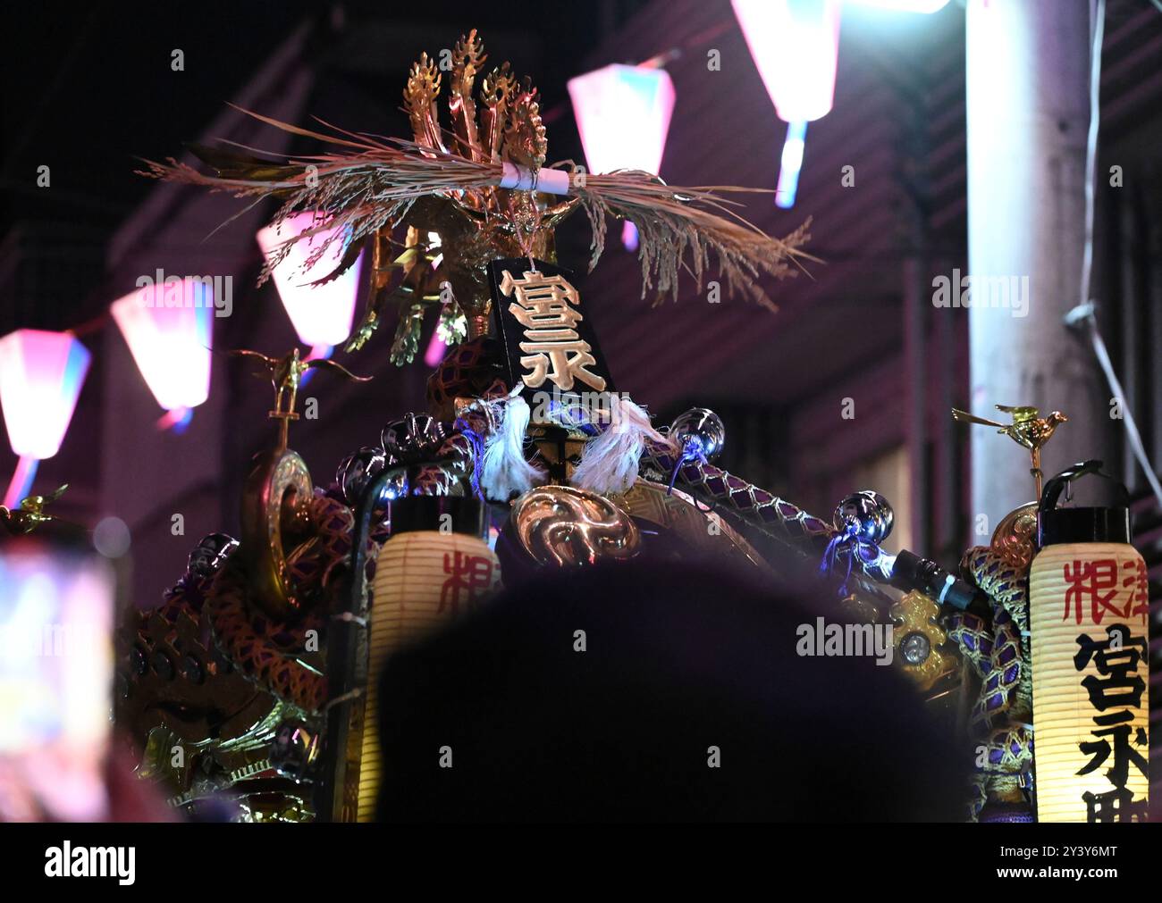 Miyanaga Town members carry a portable shrine, Mikoshi, during the Nezu ...