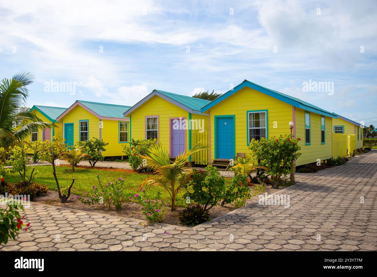 Colorful bungalows at the beach freshly painted Stock Photo - Alamy