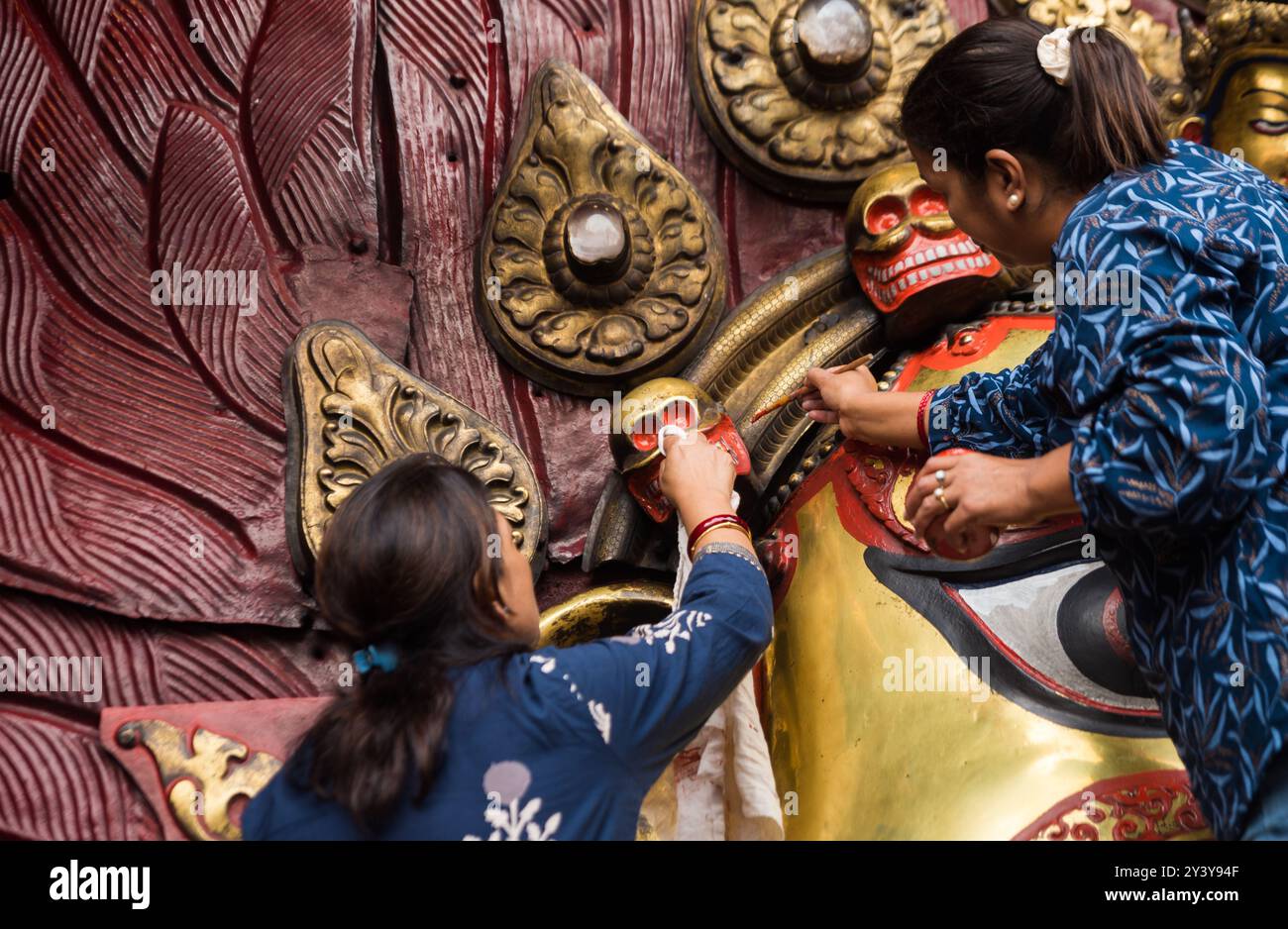 Kathmandu, Nepal. 15th Sep, 2024. Women seen painting the sculpture of ...