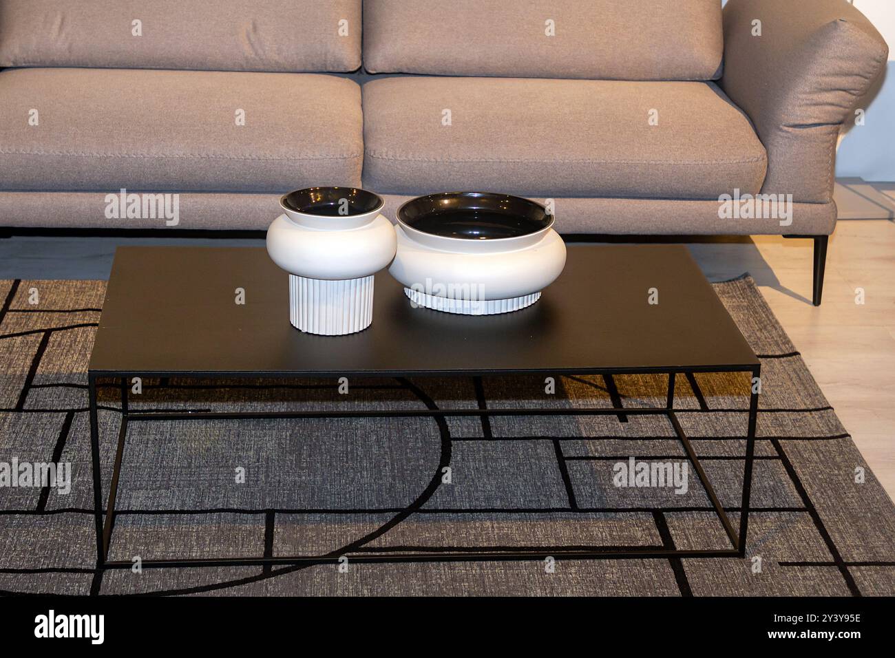 Retro ceramic bowls on wooden table inside modern interior Stock Photo ...