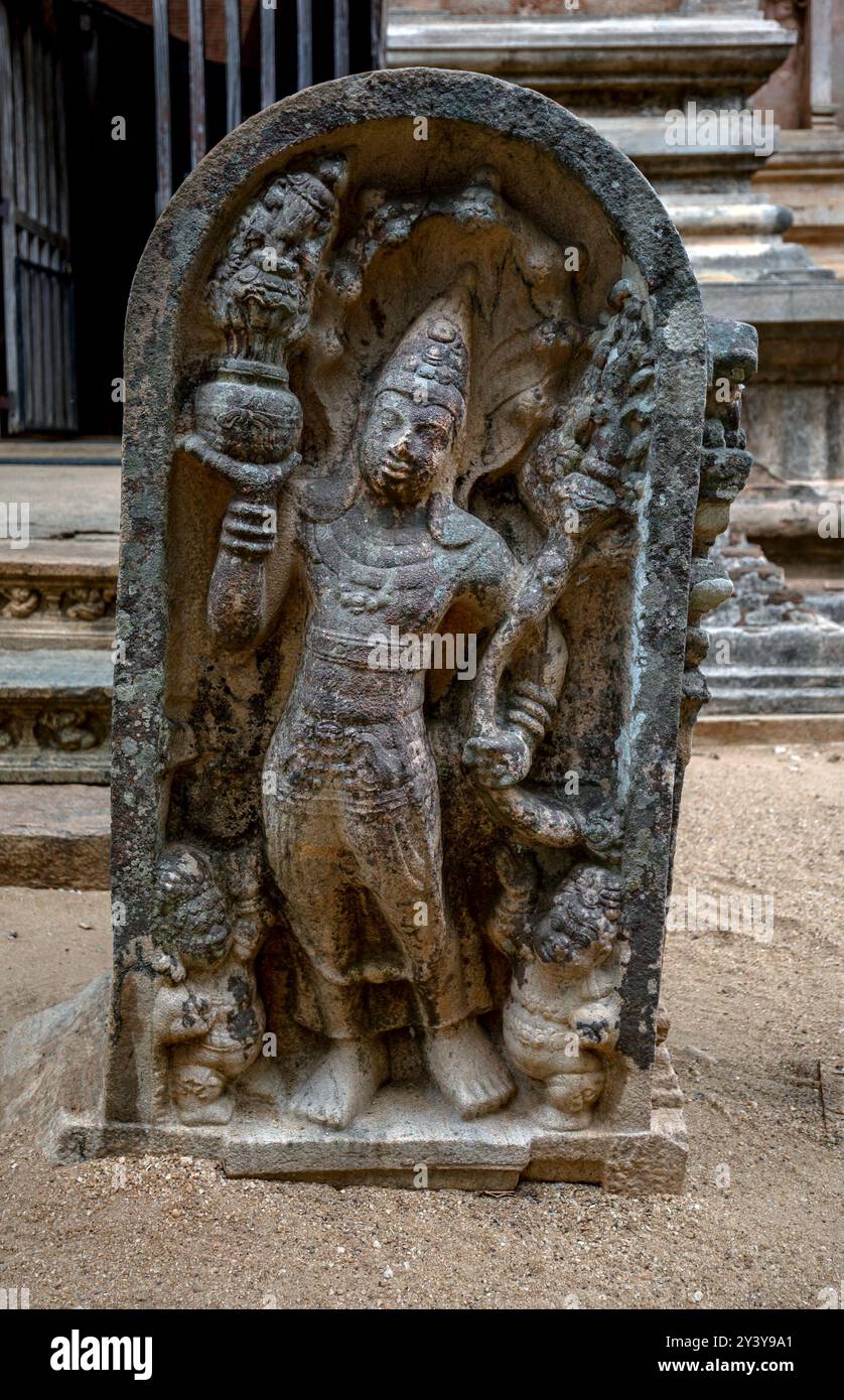 A guard stone at the entrance to the Tivanka Image House (three bends ...