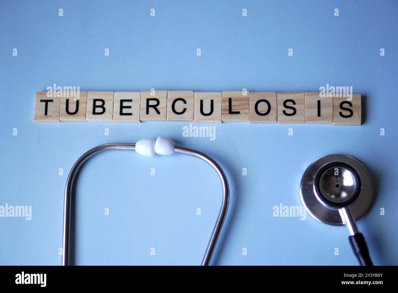 TUBERCULOSIS, wooden letters and stethoscope with a soft blue ...