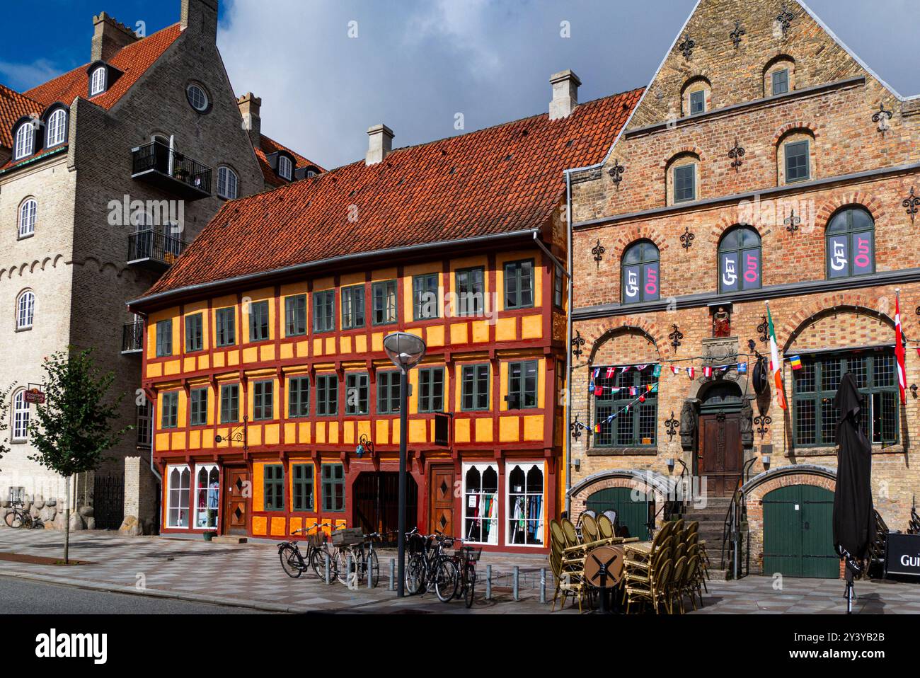 Attached half-timbered bay house with its fine shingle spire and a ...